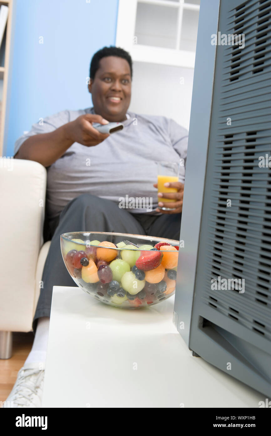Man Eating Bowl of Fruit Stock Photo - Alamy