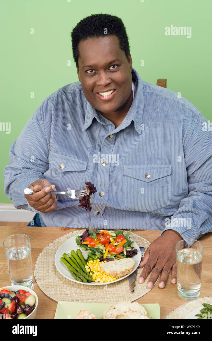 Man Eating Fruits and Vegetables Stock Photo - Alamy