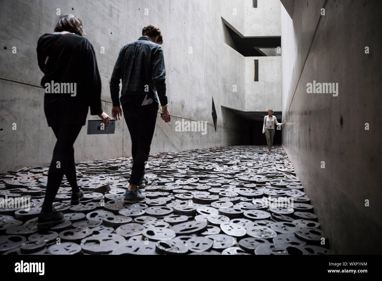 People visiting the Fallen Leaves installation in the Memory Void at ...
