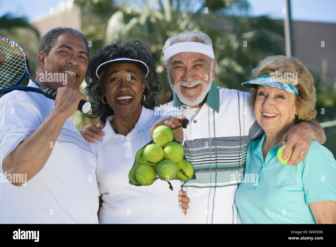 Two couples playing tennis, portrait Stock Photo - Alamy