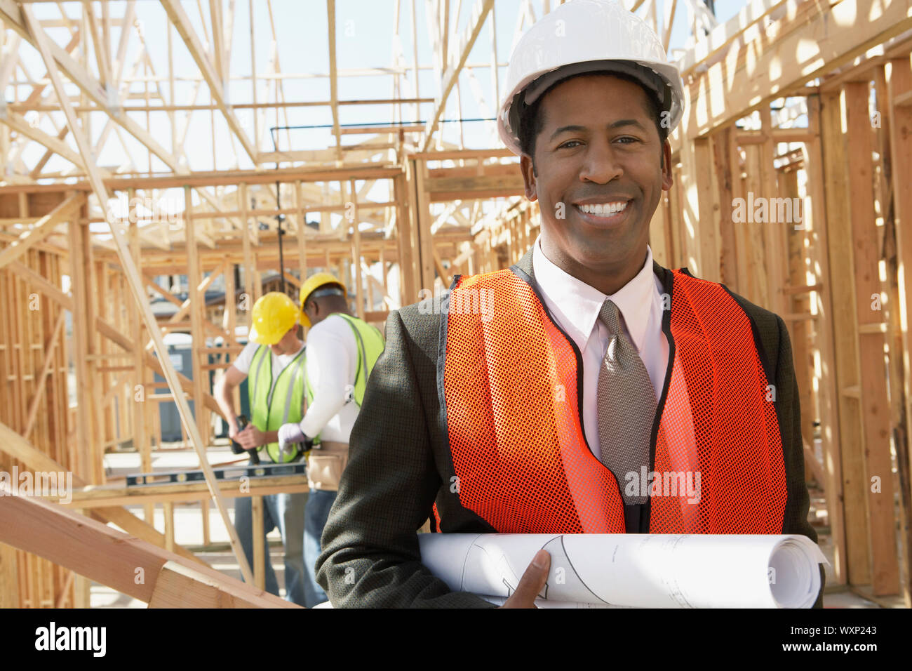 Group diverse adults construction hi-res stock photography and images ...