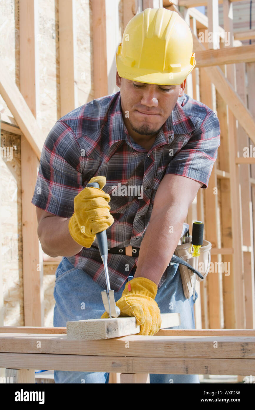 Construction worker at work on building Stock Photo - Alamy