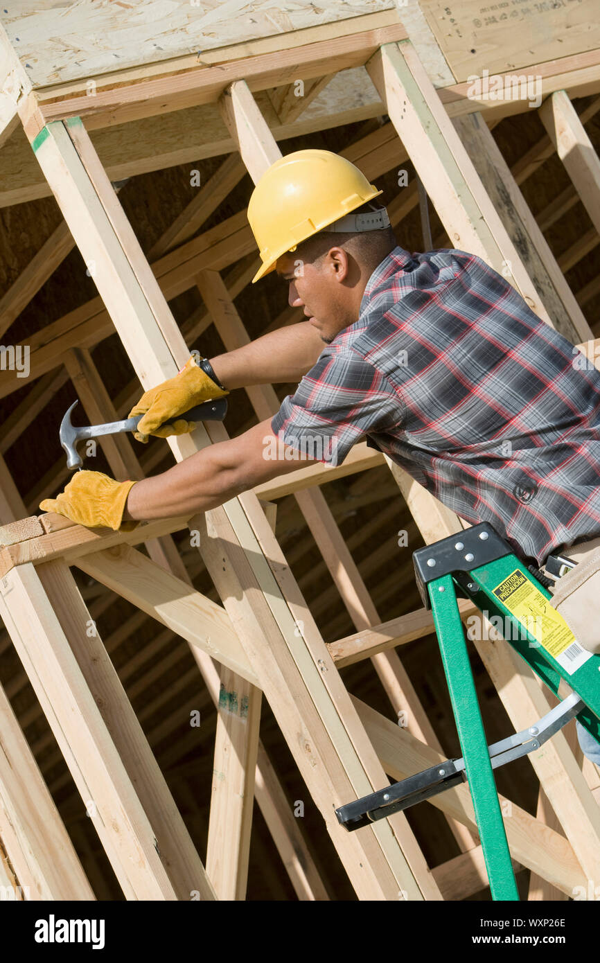 Construction worker at work on building Stock Photo - Alamy