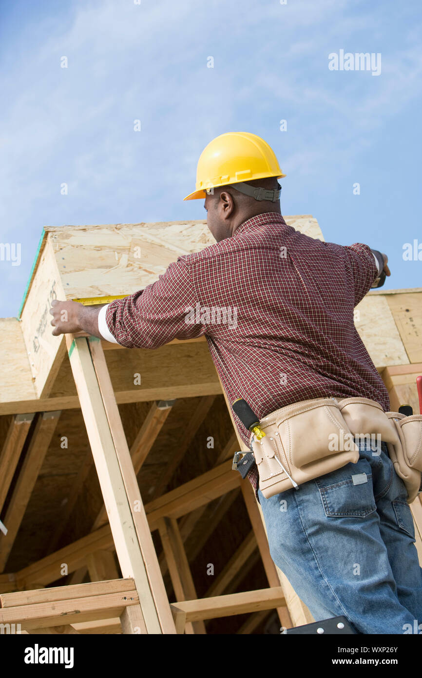 Construction worker on building Stock Photo - Alamy