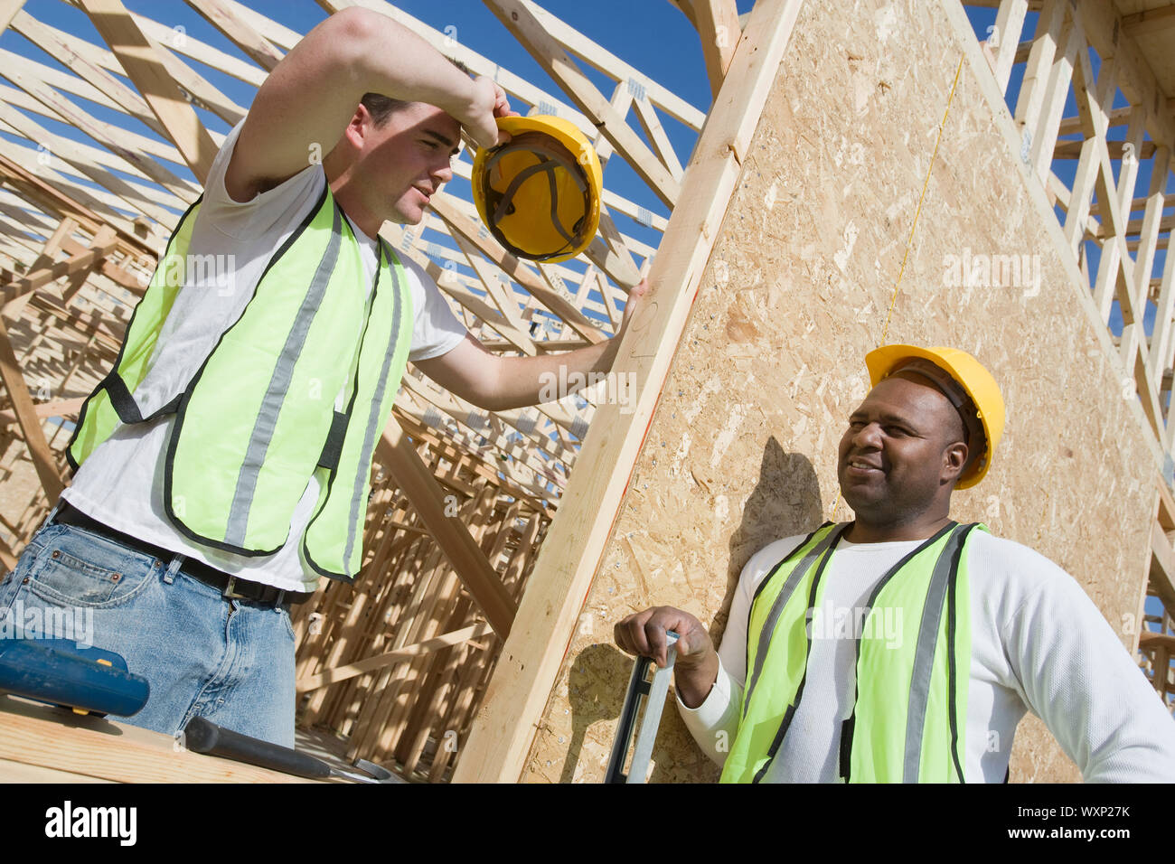 Two construction workers on site Stock Photo - Alamy