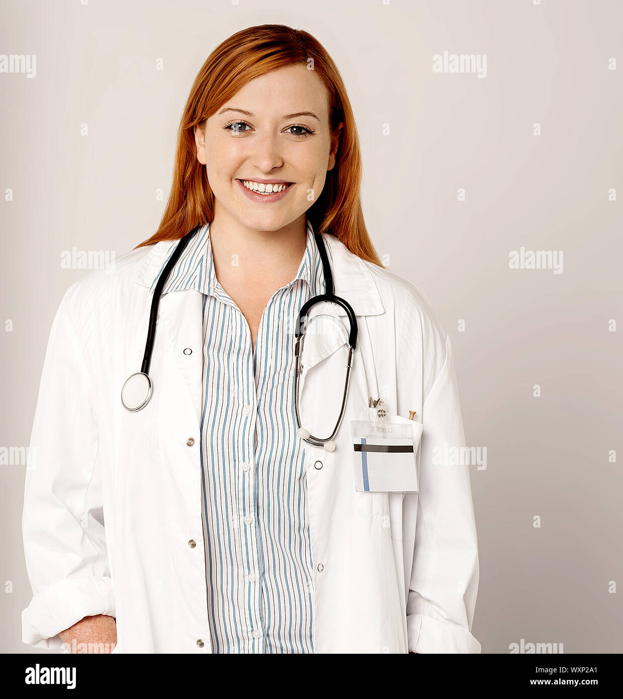 Lady surgeon with stethoscope around her neck Stock Photo - Alamy