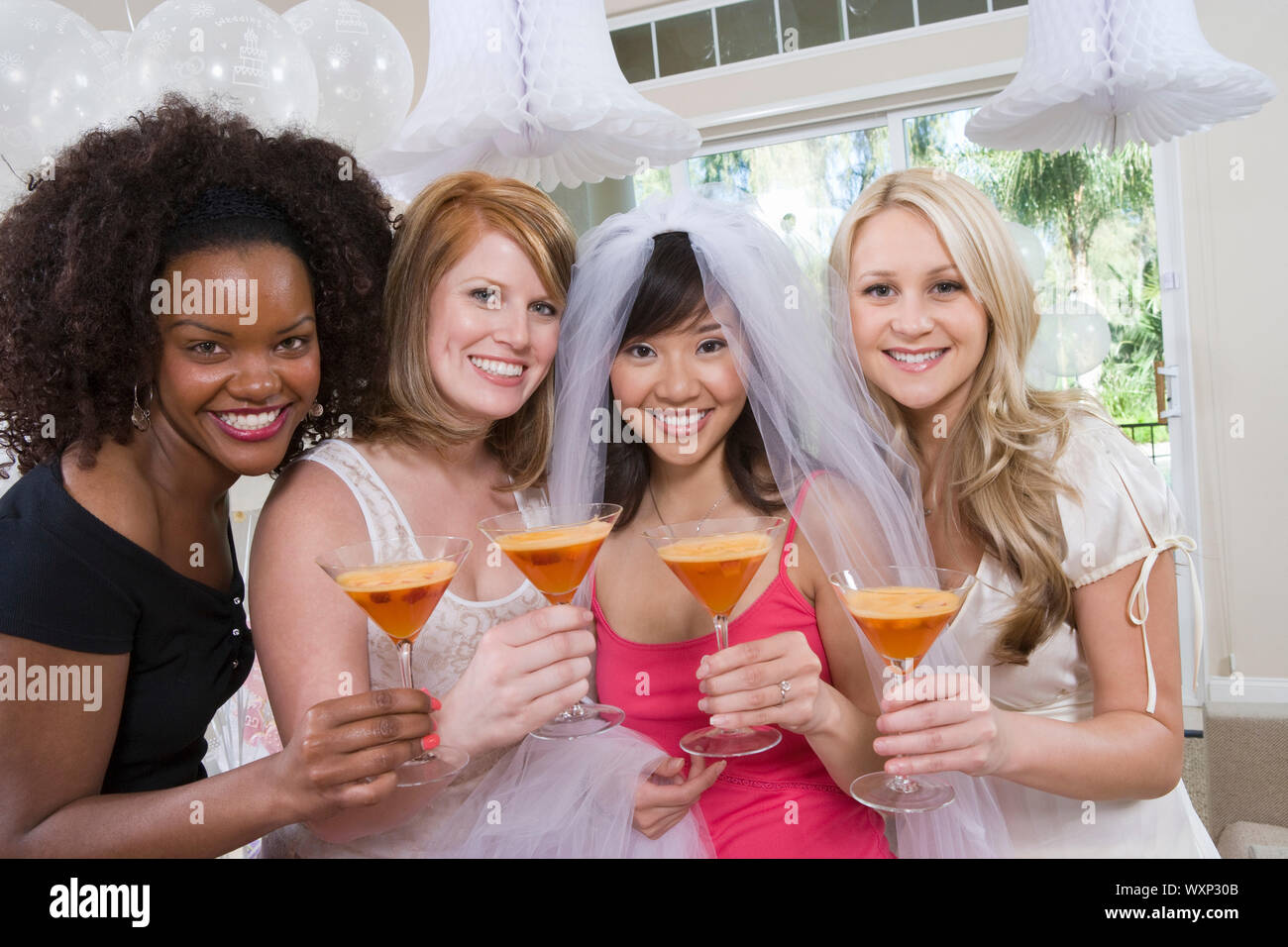 Friends Drinking Cocktails at Bridal Shower Stock Photo - Alamy