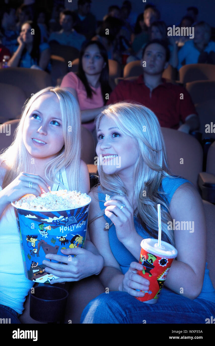 Friends Watching Movie Together Stock Photo - Alamy