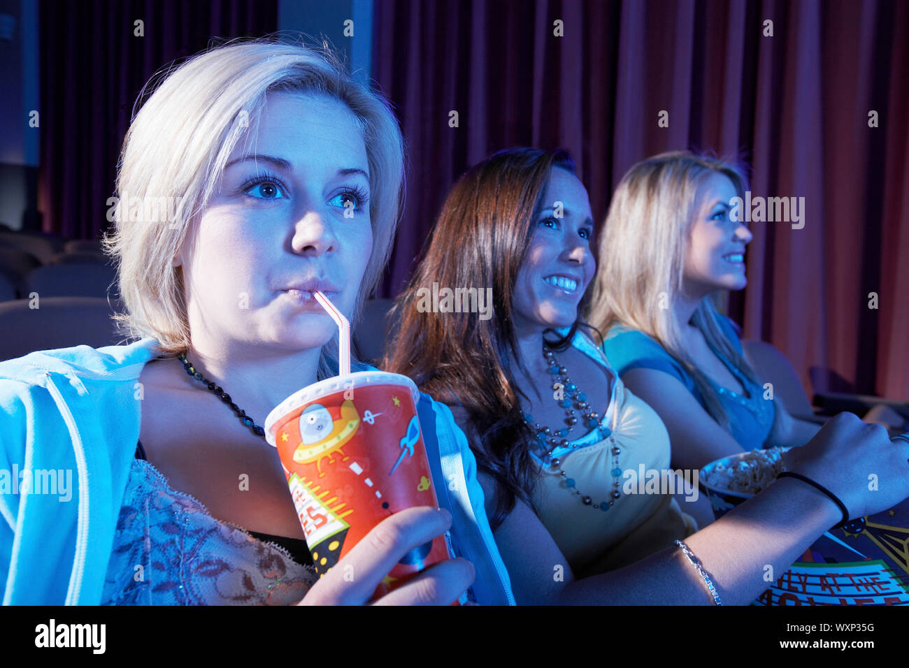 Friends Watching Movie Together Stock Photo - Alamy