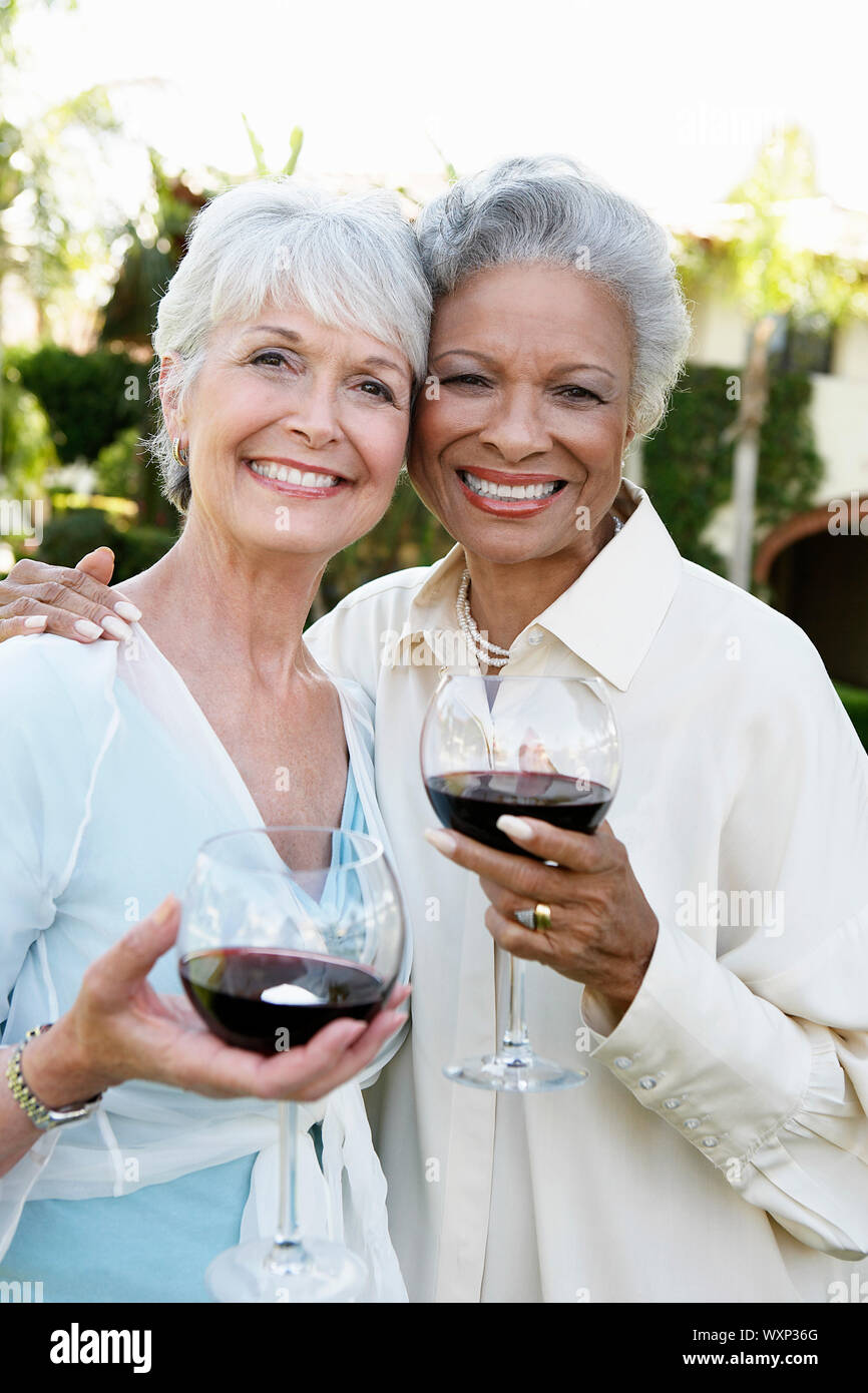 Mixed race older women friends outside hi-res stock photography and ...