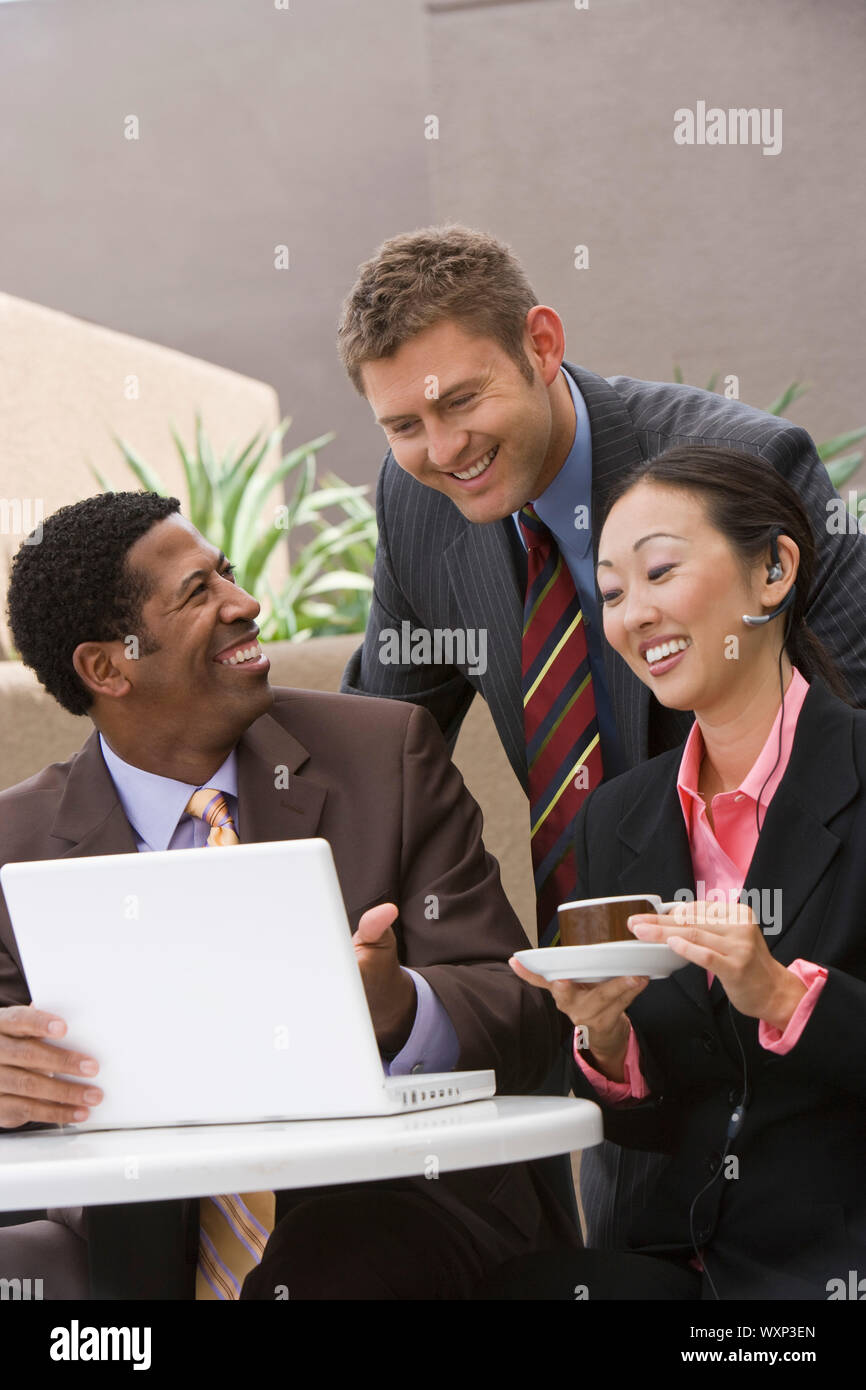 Three business people having meeting Stock Photo - Alamy