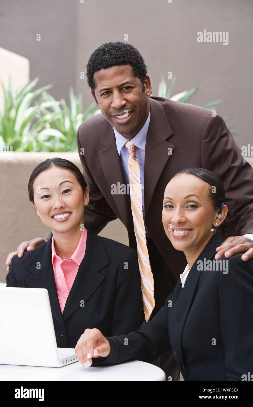 Three business people having meeting Stock Photo - Alamy