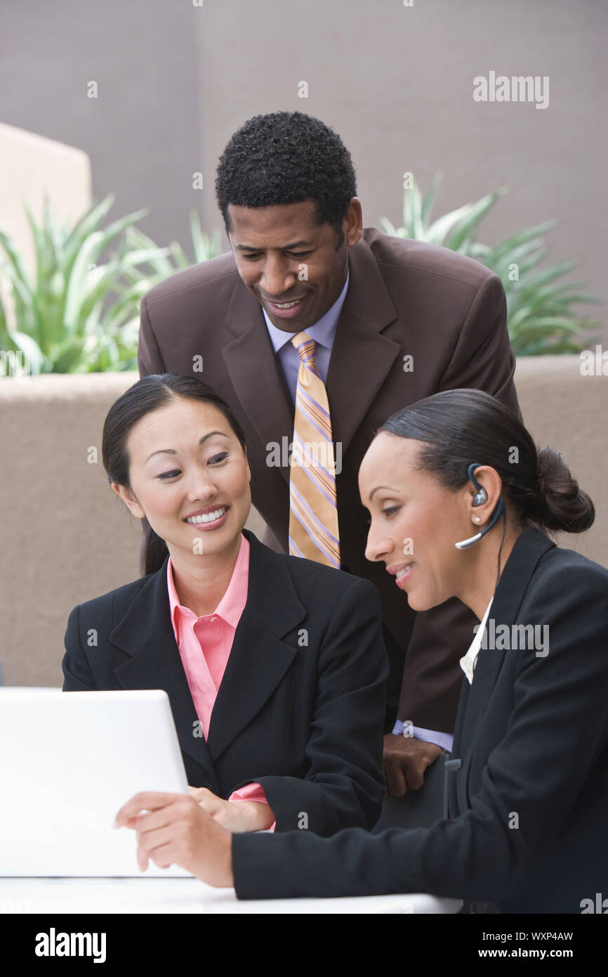 Three business people having meeting Stock Photo - Alamy