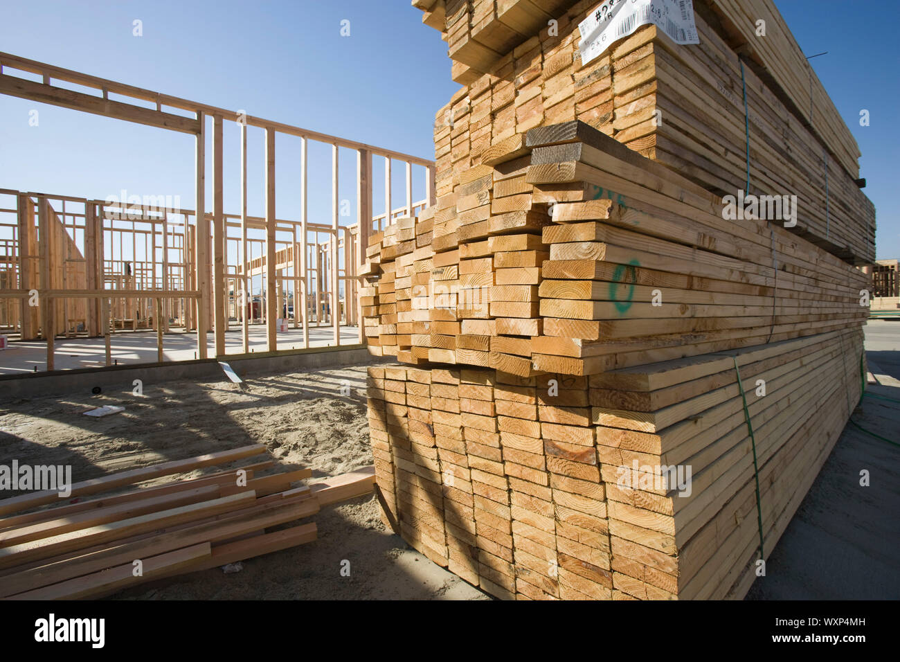 House construction and stack of planks Stock Photo - Alamy