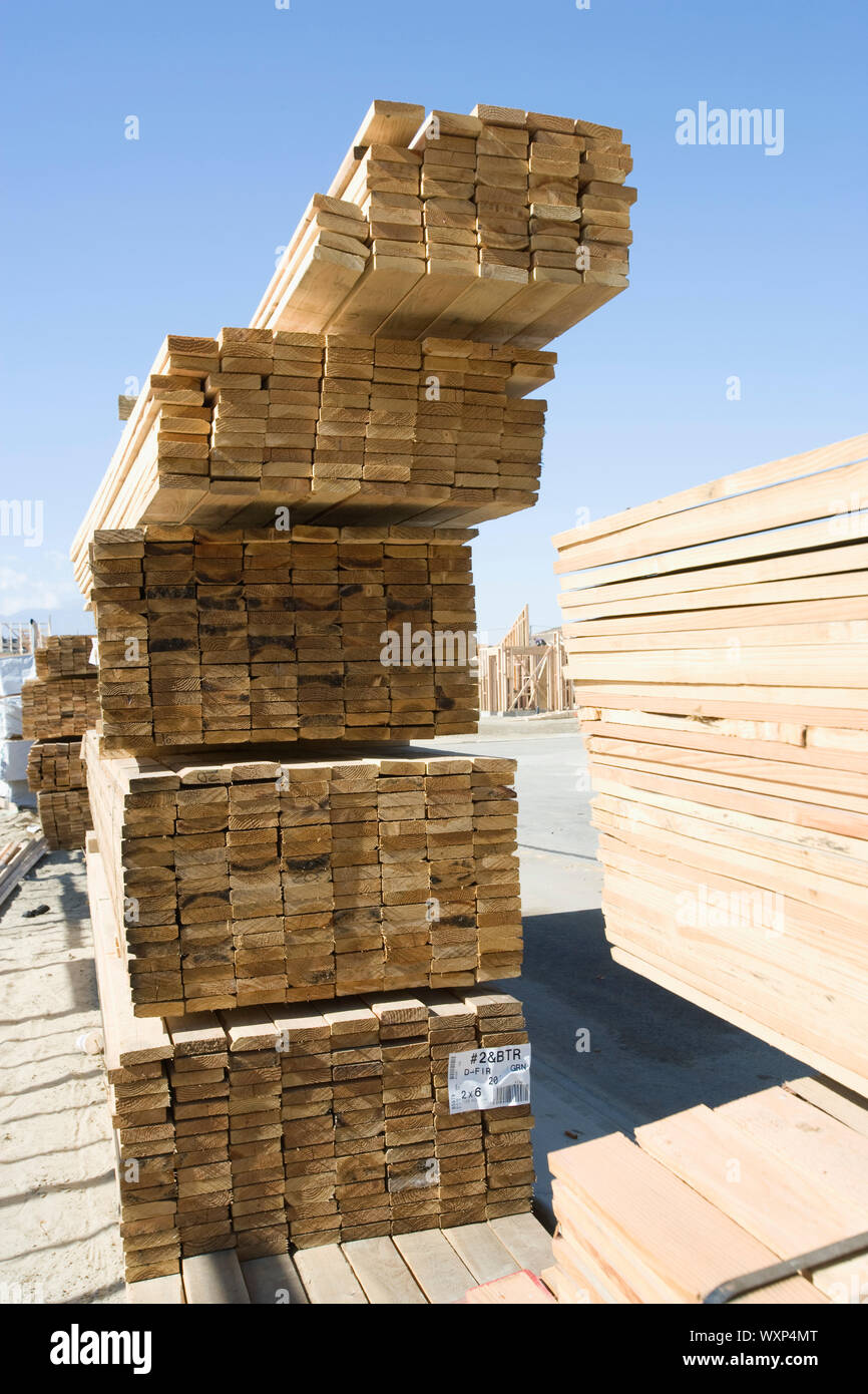 Stacks of planks for new house Stock Photo - Alamy