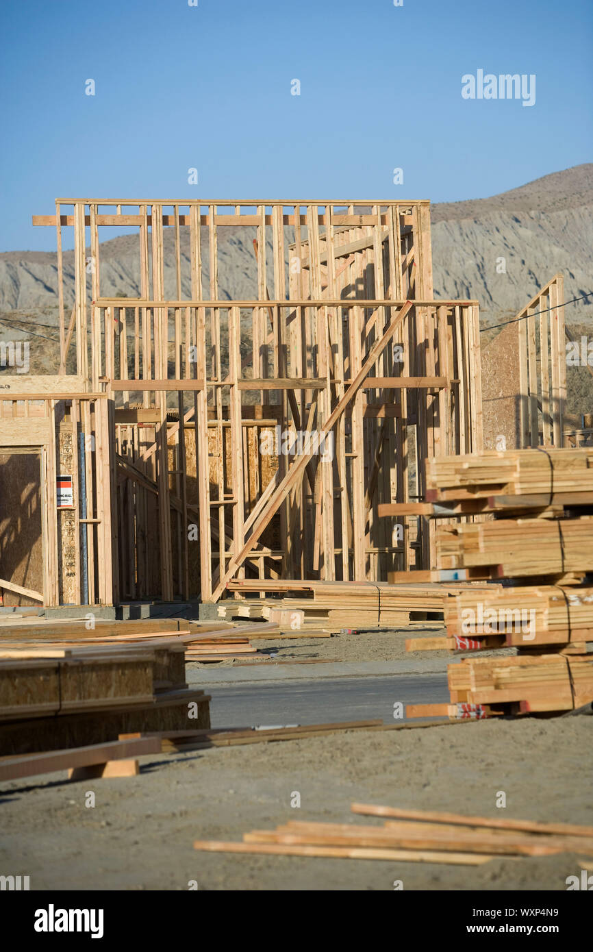 Building construction and stacks of planks Stock Photo - Alamy