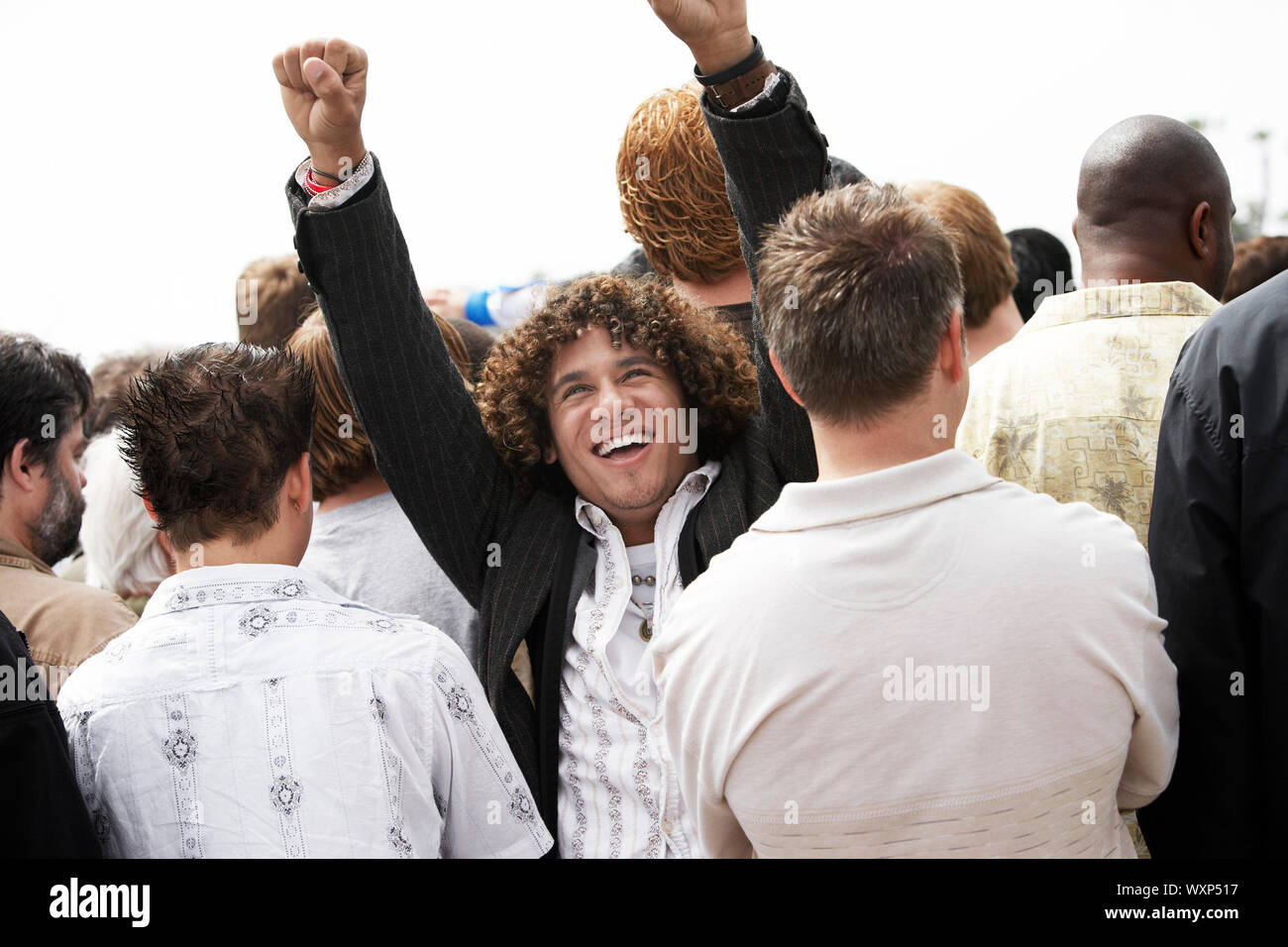 Man Raising His Fists at Rally Stock Photo - Alamy