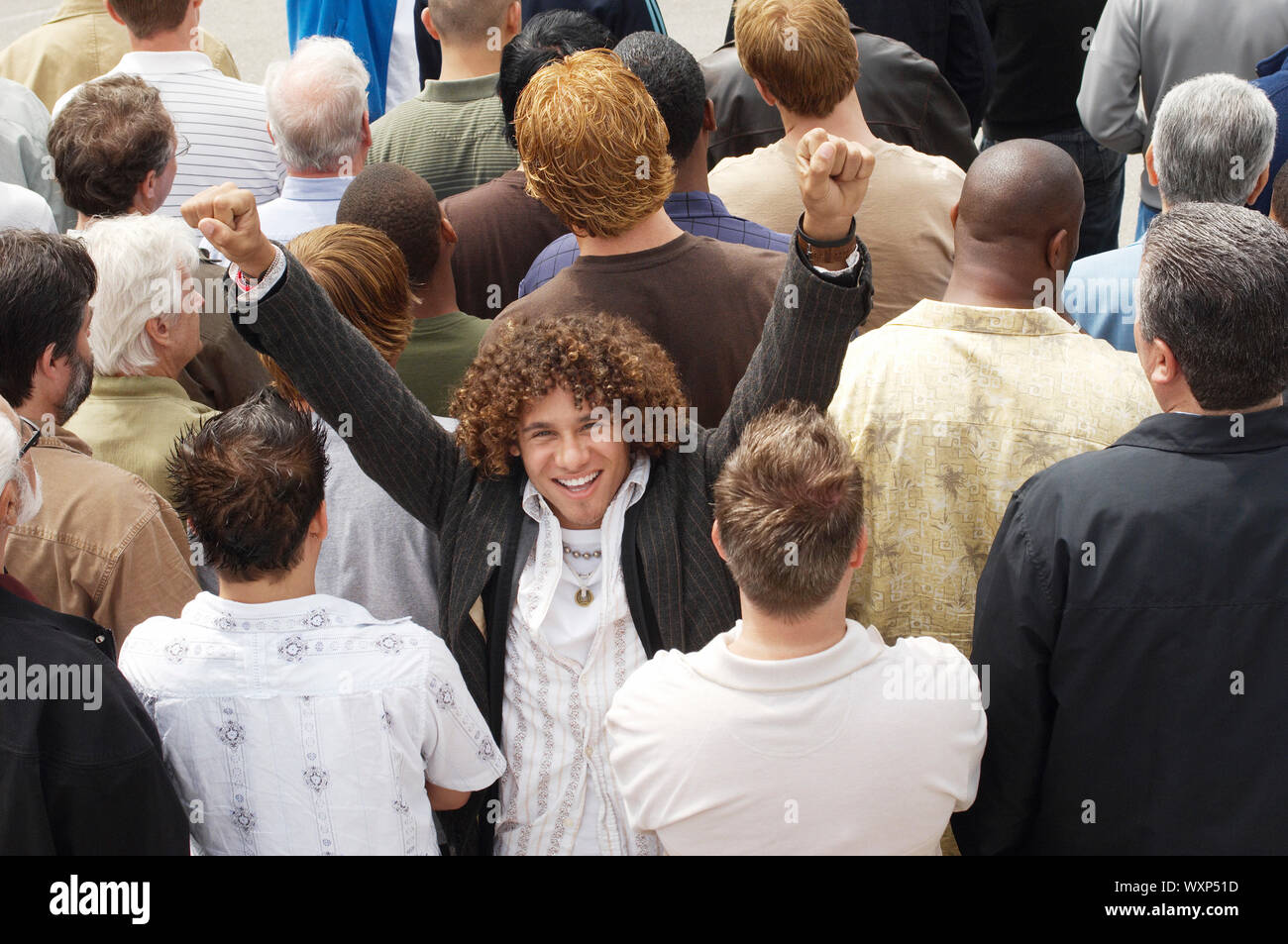 Man Raising Fists at Rally Stock Photo - Alamy