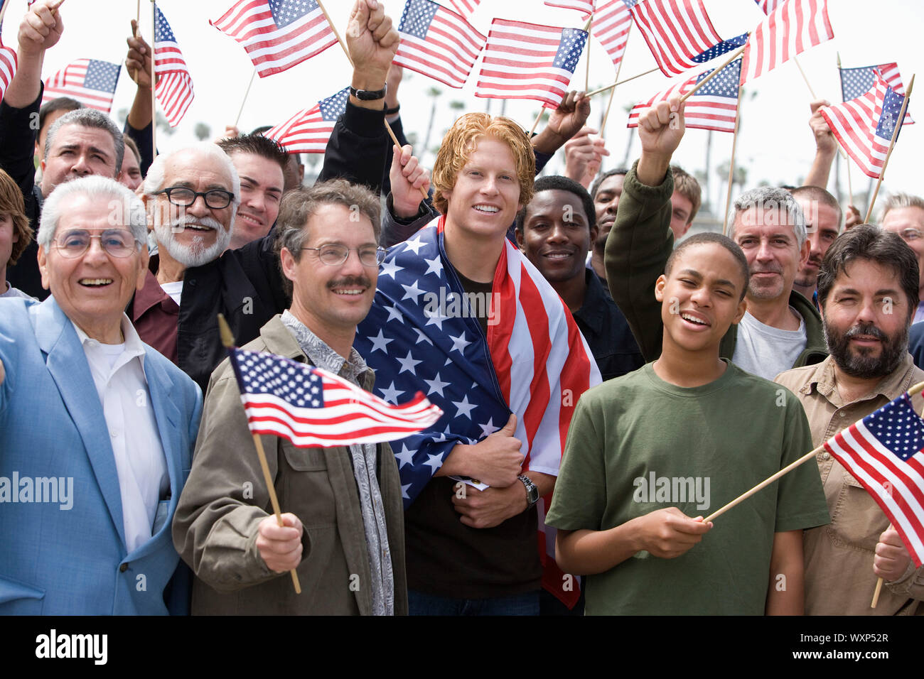 Crowd holding American flags Stock Photo - Alamy