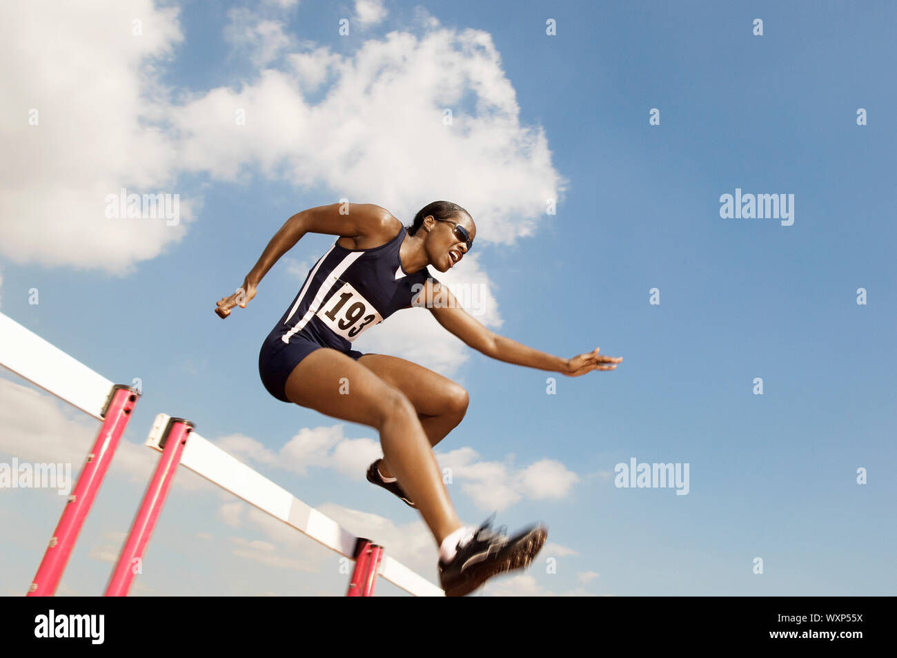 Hurdler in mid air hi-res stock photography and images - Alamy