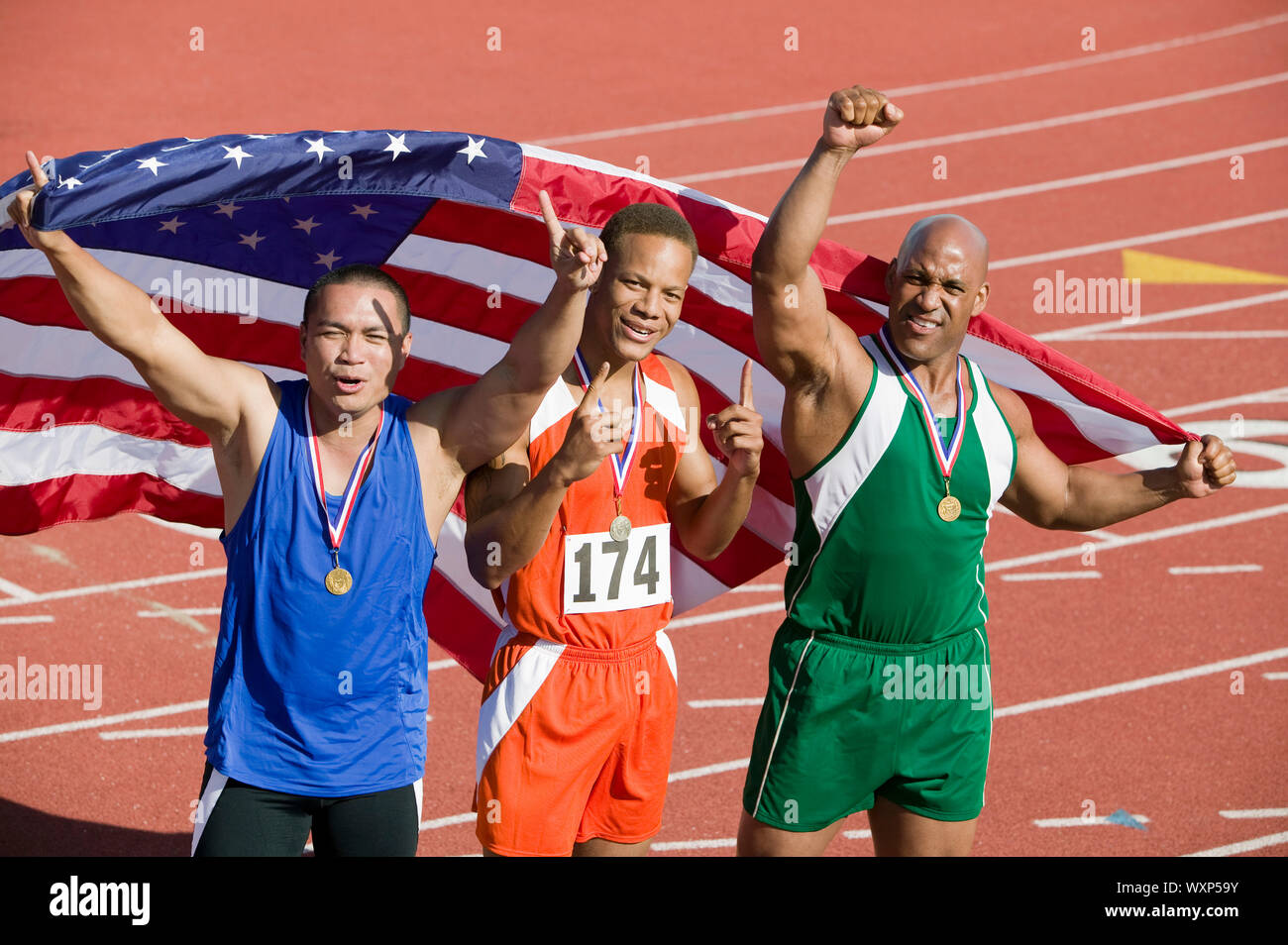 Three athletes running up hi-res stock photography and images - Alamy