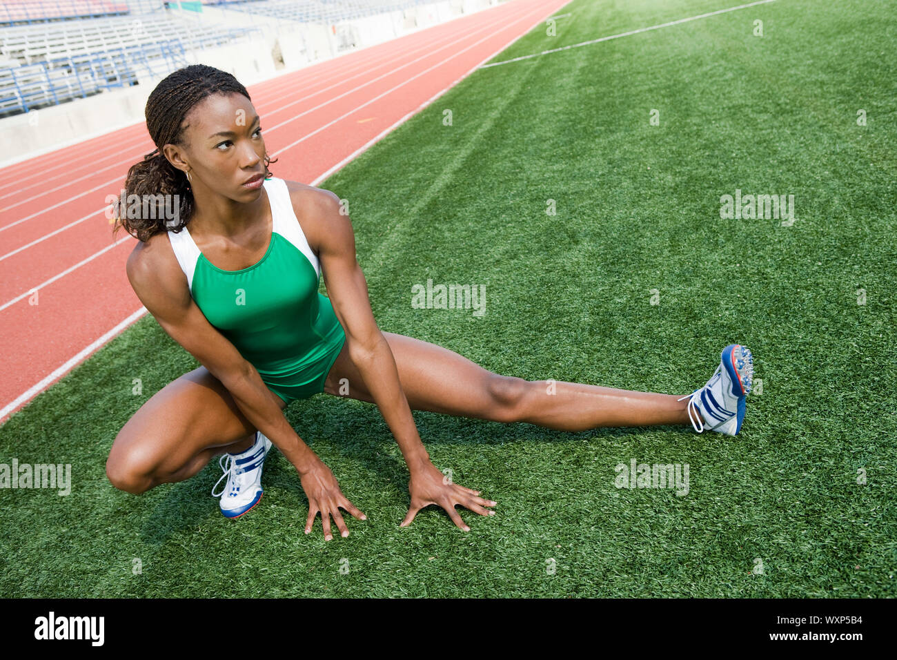Female athlete stretching Stock Photo - Alamy