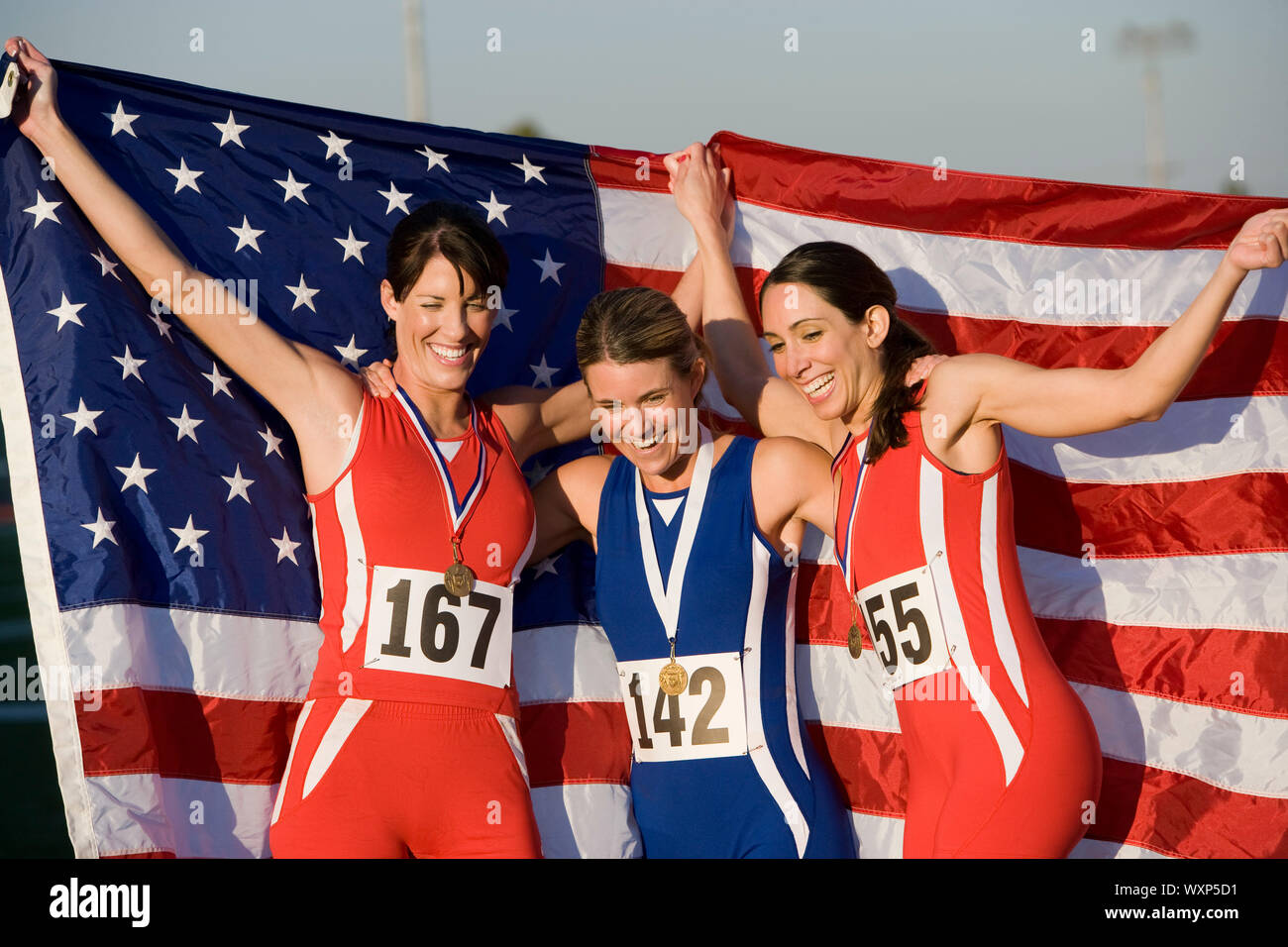 Team of American female athletes celebrating victory Stock Photo - Alamy