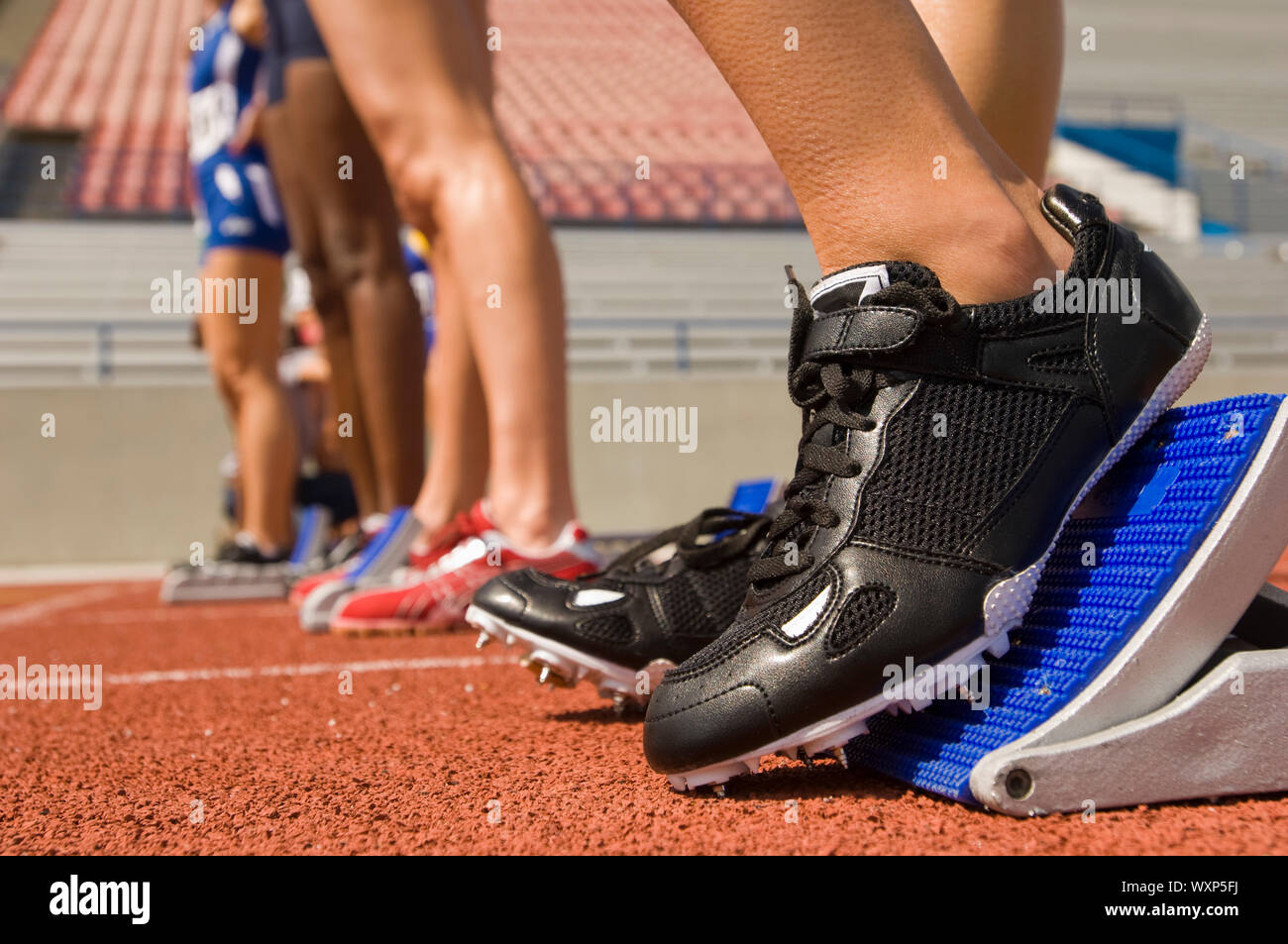 Female athletes in starting blocks hi-res stock photography and images ...