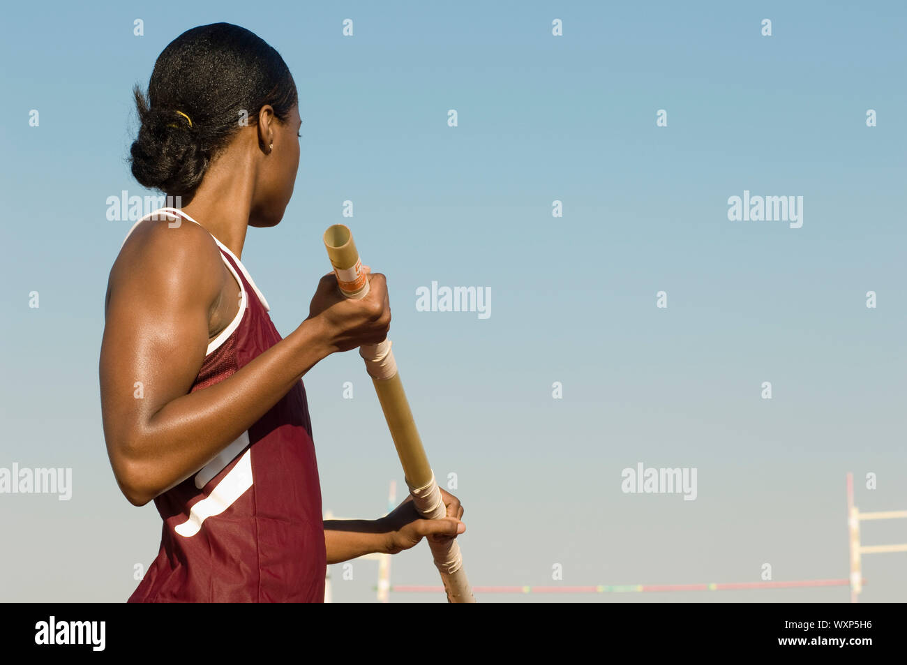Female athlete preparing for pole jump Stock Photo - Alamy