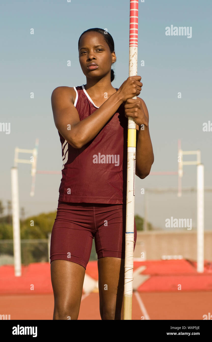 Female athlete preparing for pole jump Stock Photo - Alamy