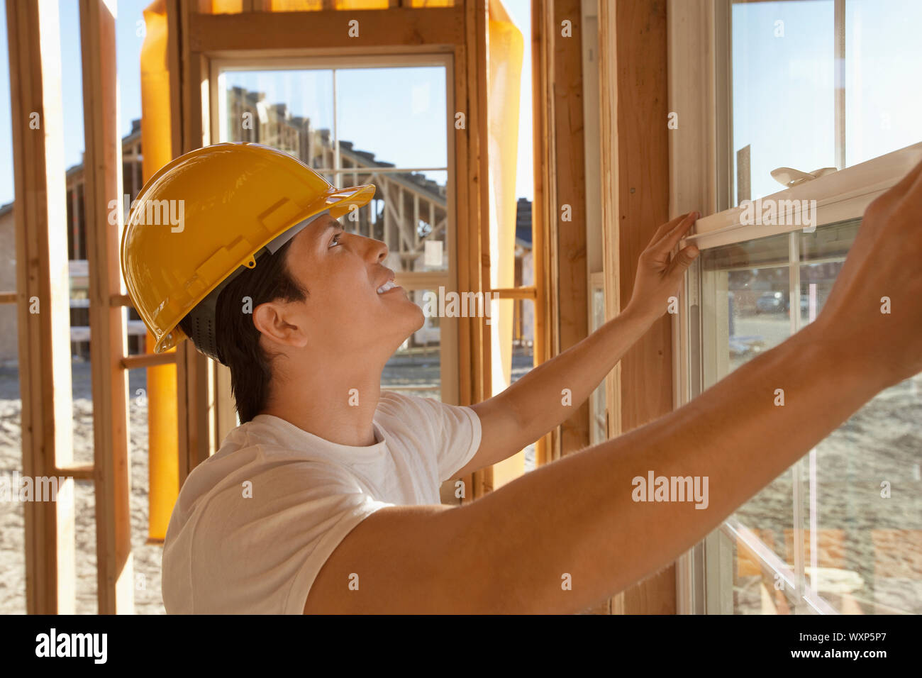 Construction Worker Building a House Stock Photo - Alamy