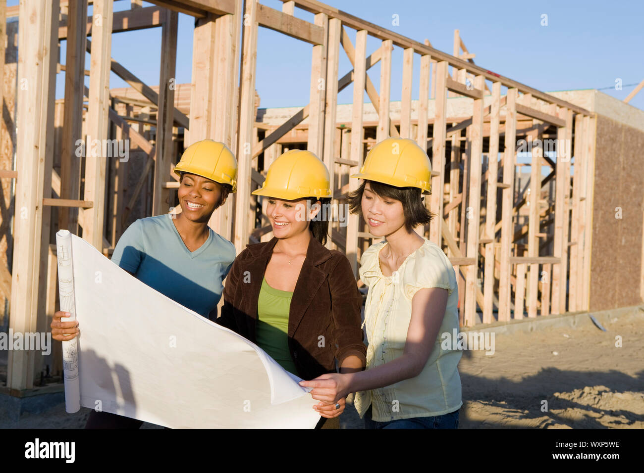 Young women in construction site Stock Photo - Alamy