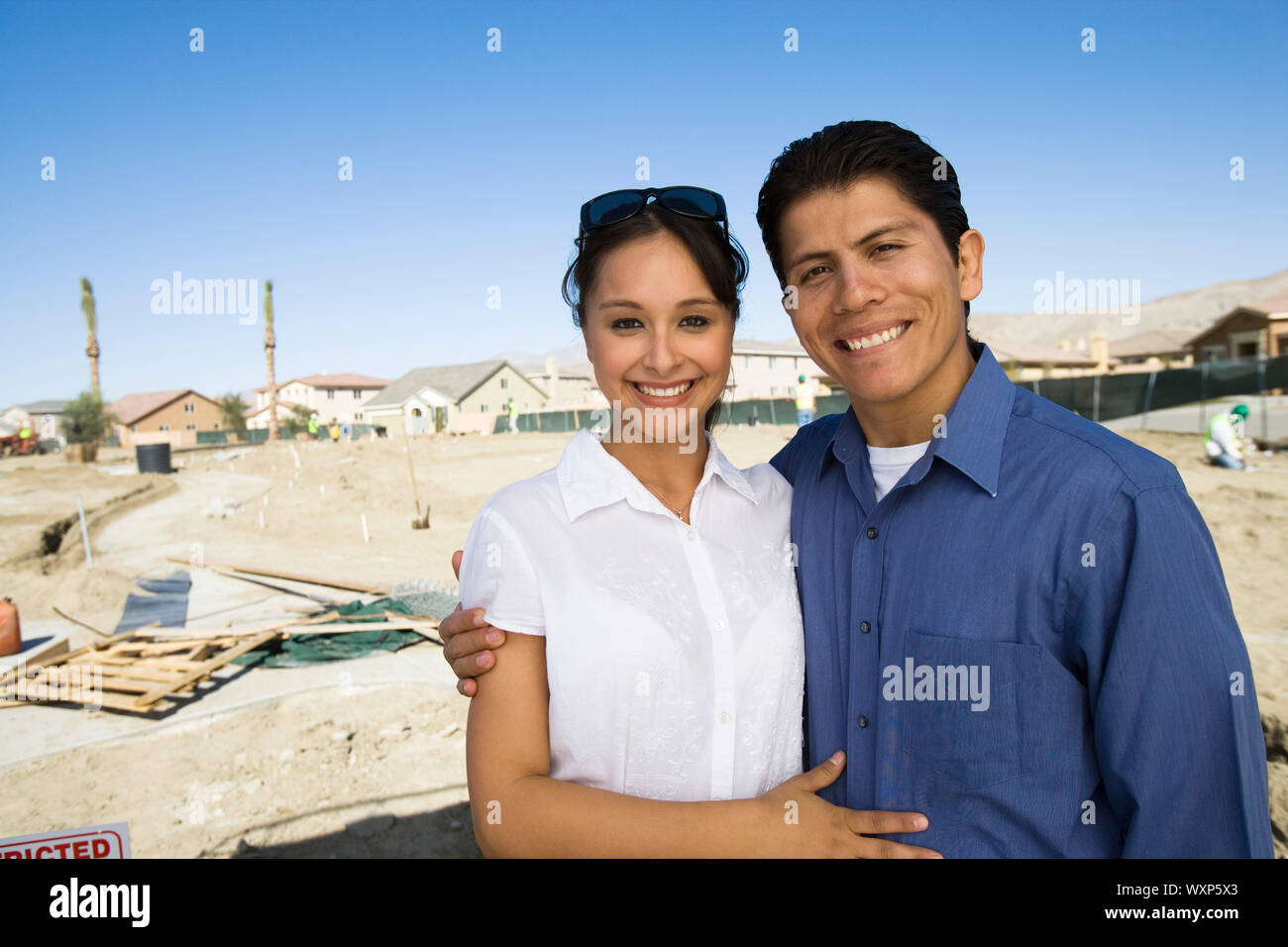 Couple in construction site Stock Photo - Alamy