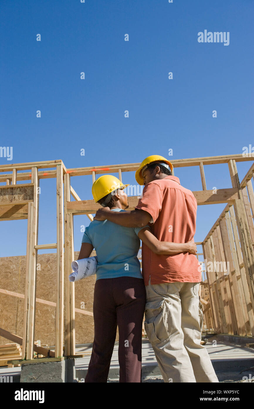 Couple in construction site Stock Photo - Alamy