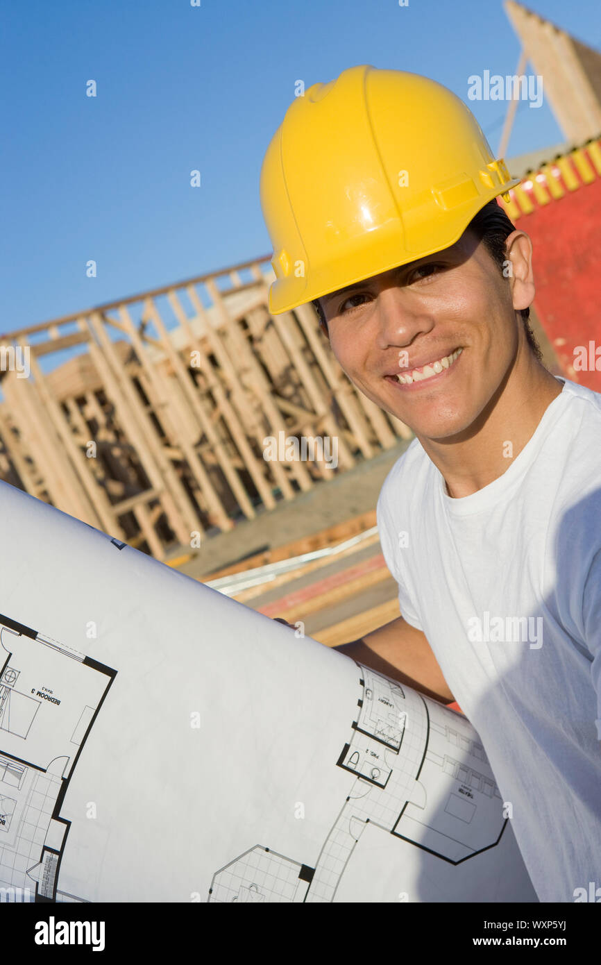 Construction worker smiling Stock Photo - Alamy