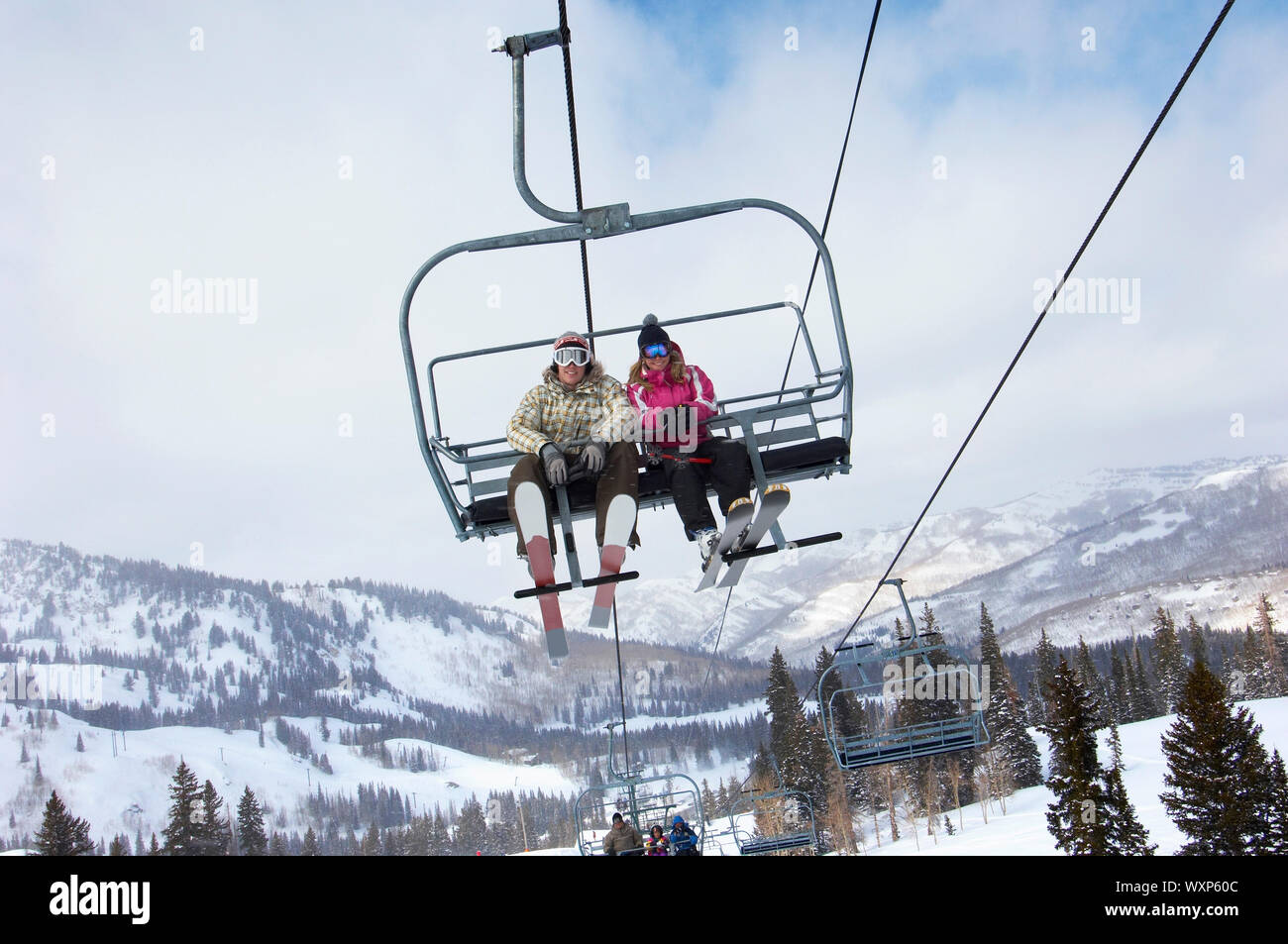 Young Couple on the Chair Lift Stock Photo - Alamy