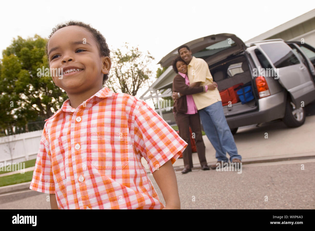 Boy Looking Around Neighborhood Stock Photo - Alamy