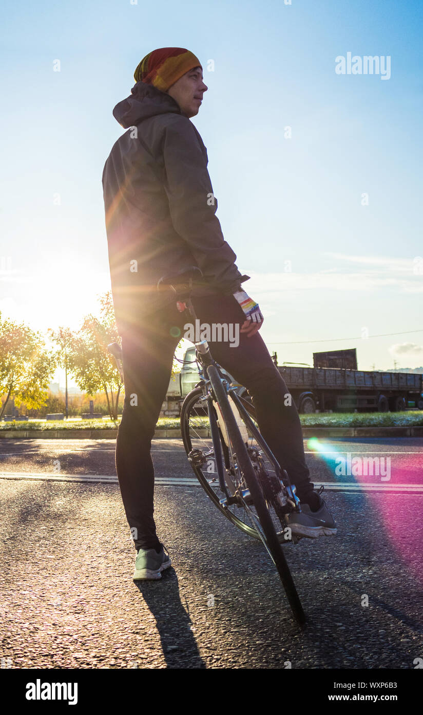 Biker standing at back wheel hi-res stock photography and images - Alamy