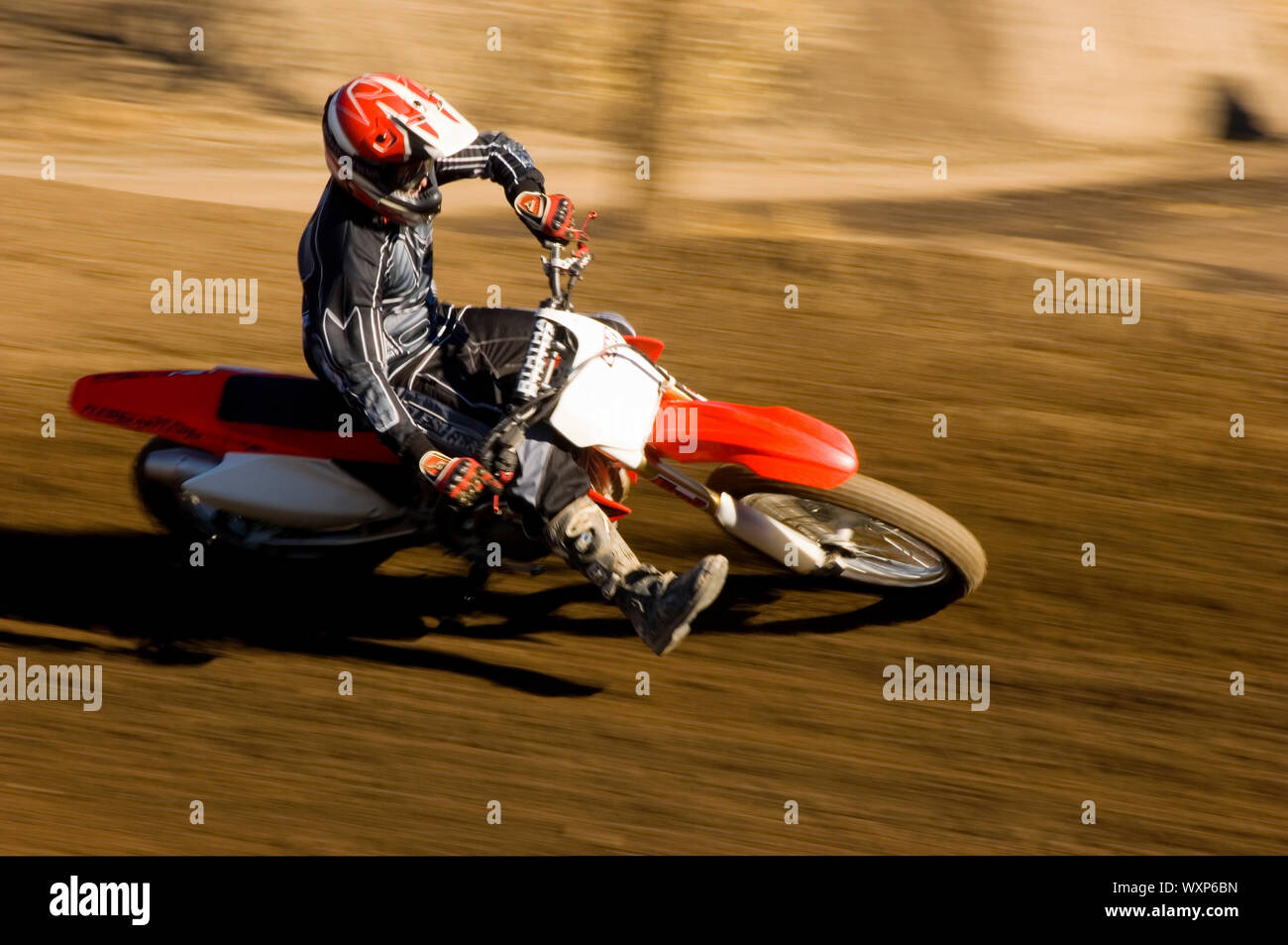 Motocross Racer Taking Corner Stock Photo - Alamy