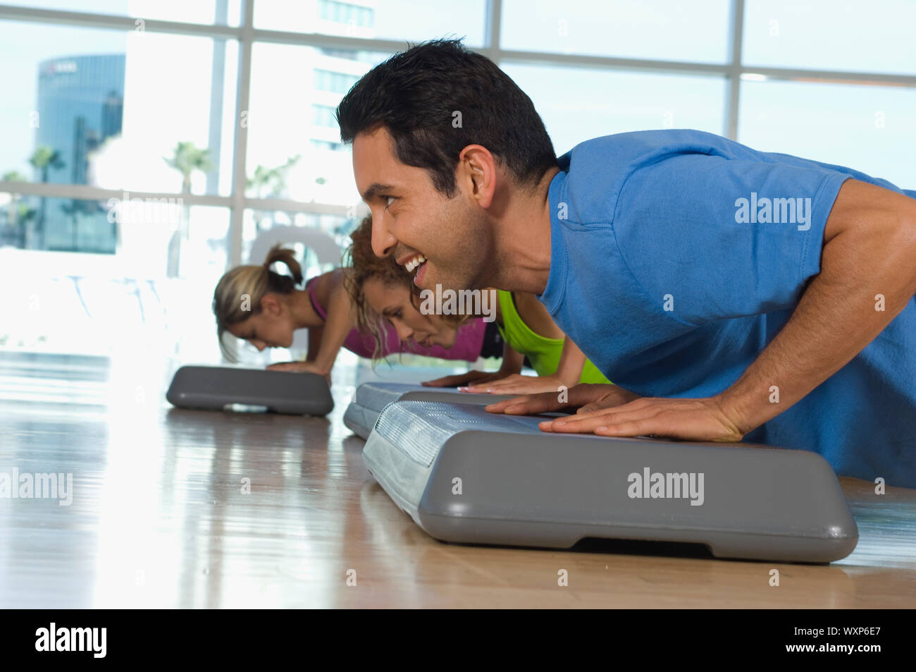 People Doing Pushups in Exercise Class Stock Photo - Alamy