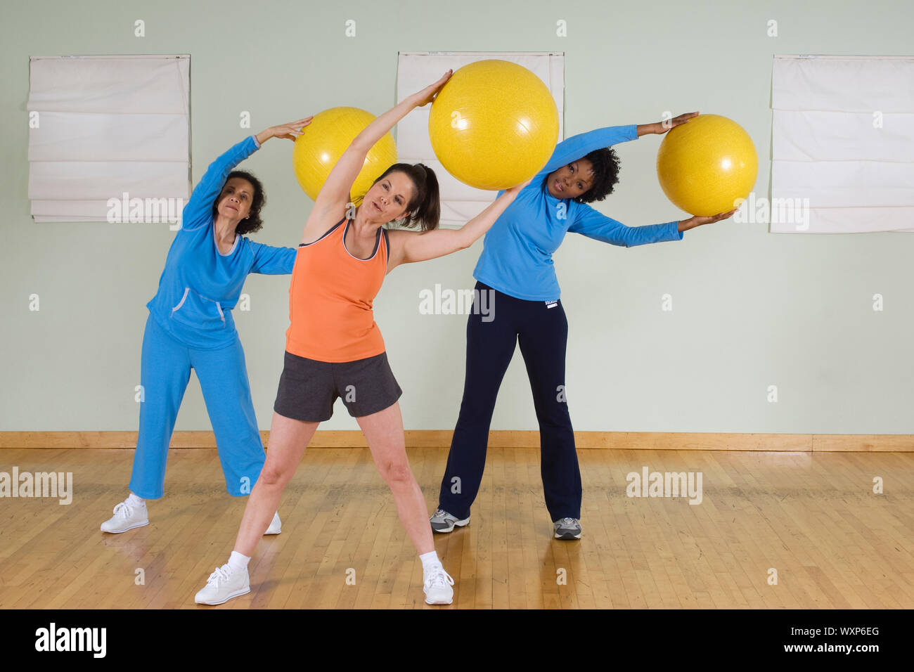 Women Using Exercise Balls in Fitness Class Stock Photo - Alamy