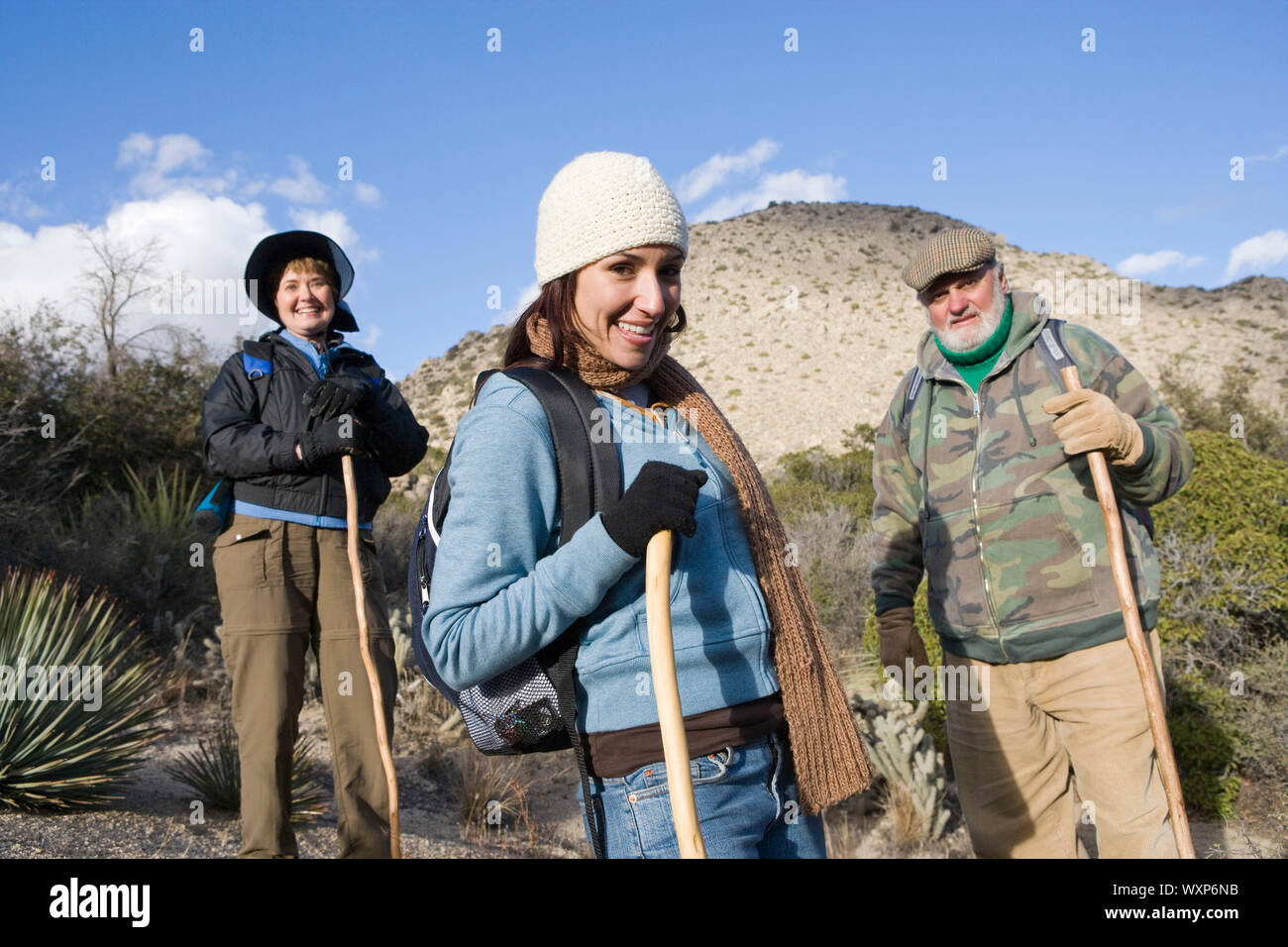 Three hikers on a trail Stock Photo - Alamy