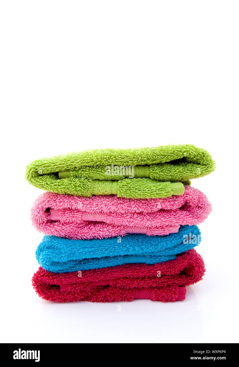 Stack of colorful towels on a white background Stock Photo - Alamy