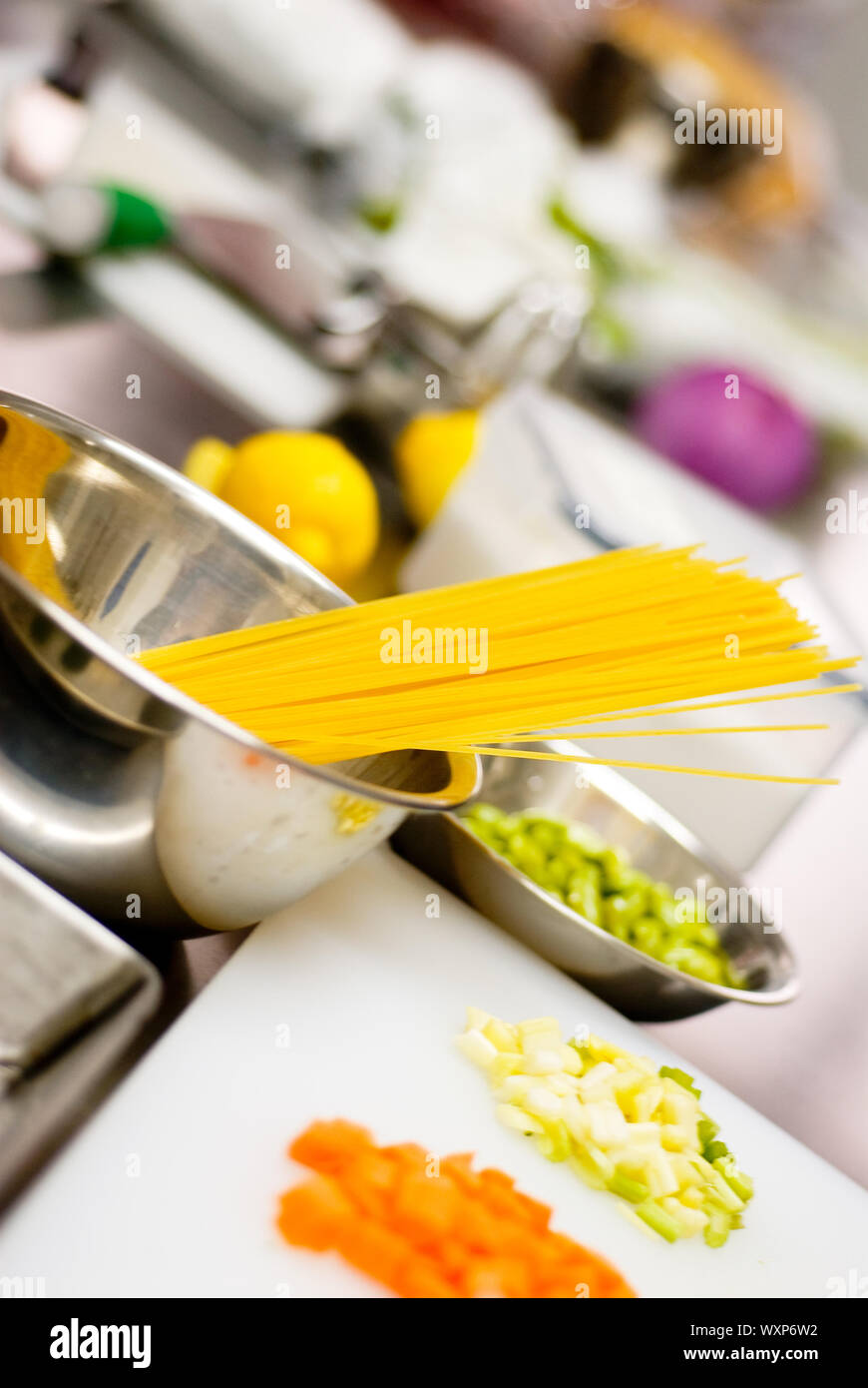italian spaghetti pasta on a typical full equipped restaurant kitchen ...