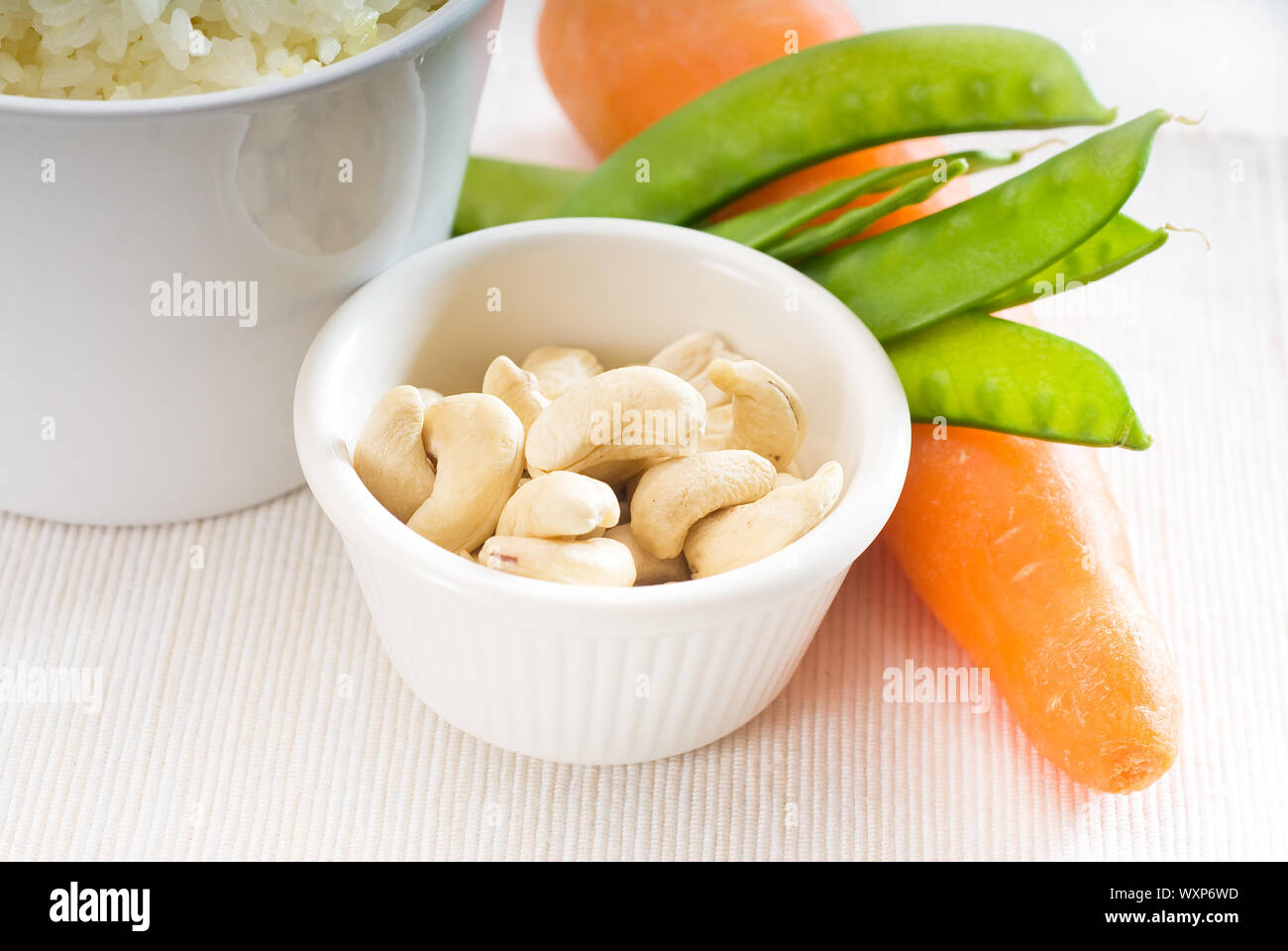 fresh cashew nut and vegetables,with steamed white rice ,typical ...