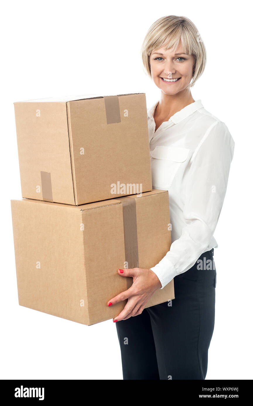 Beautiful lady holding stack of parcel boxes Stock Photo - Alamy
