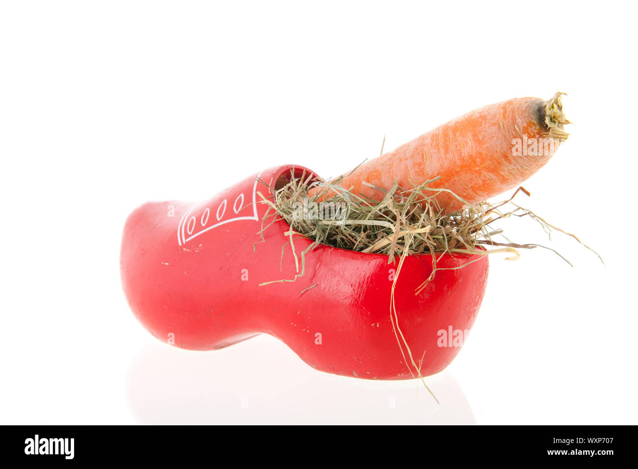 Dutch red wooden clog with carrot for the horse of Sinterklaas Stock ...