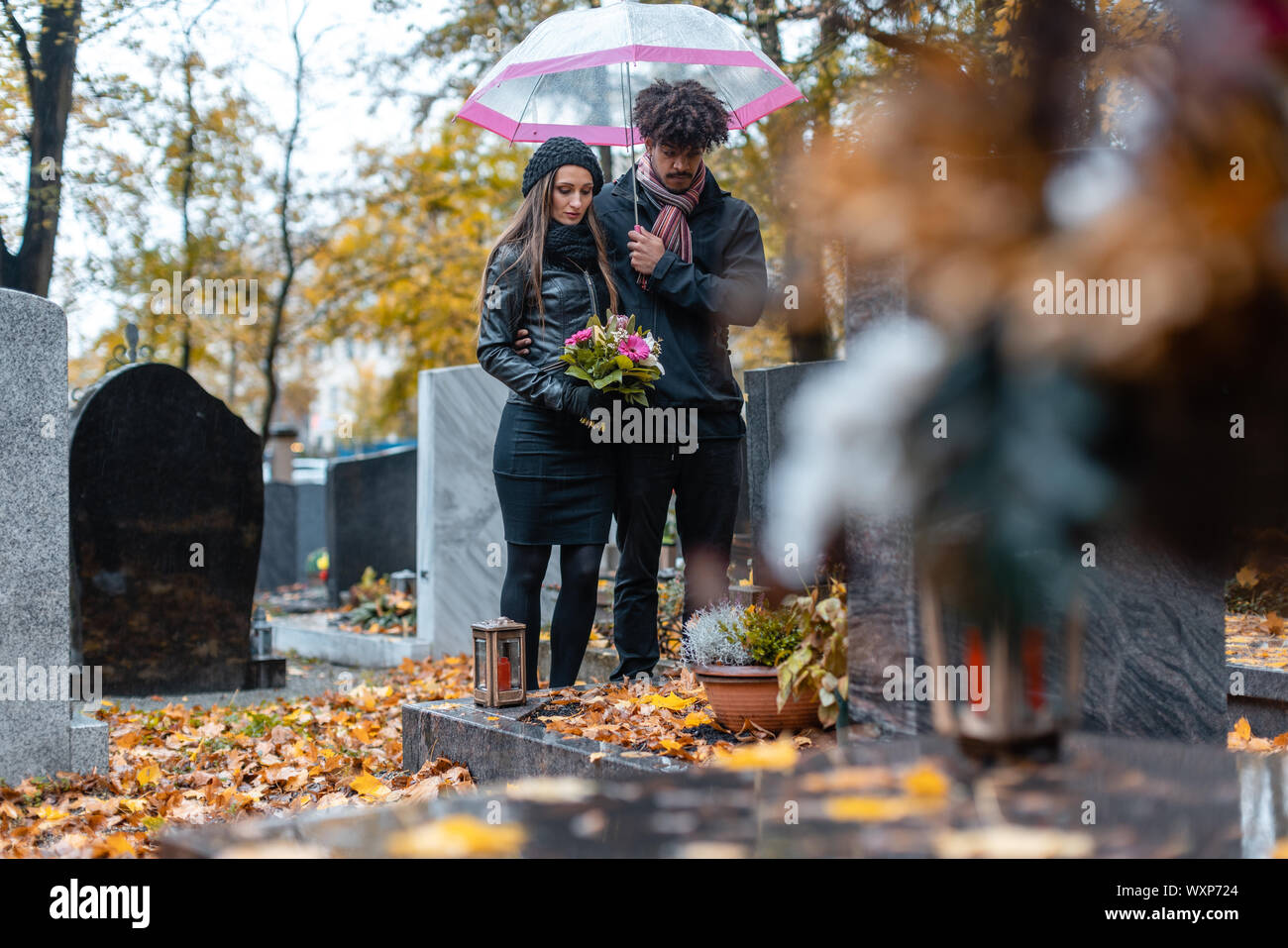 Woman standing grave in cemetery hi-res stock photography and images ...