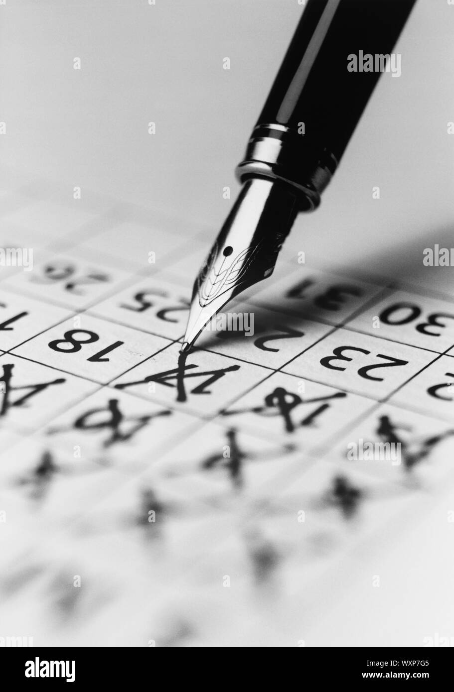 Pen Marking the Days on a Calendar Stock Photo - Alamy