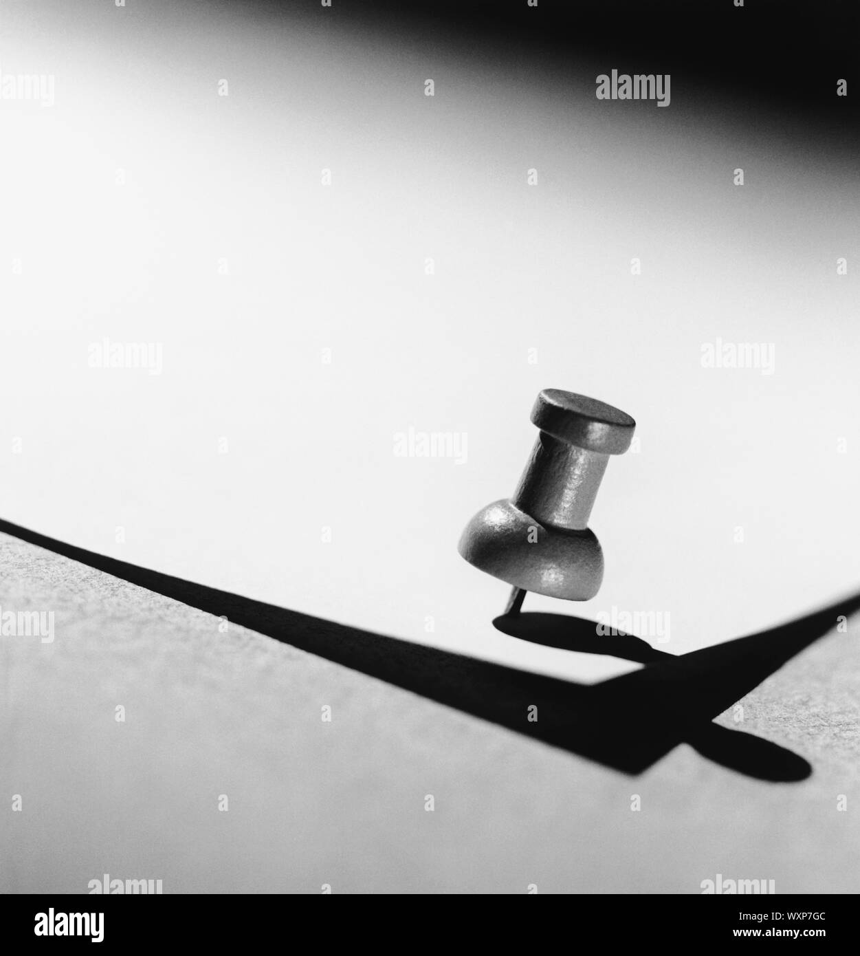 Push Pin Holding Down Paper Stock Photo - Alamy